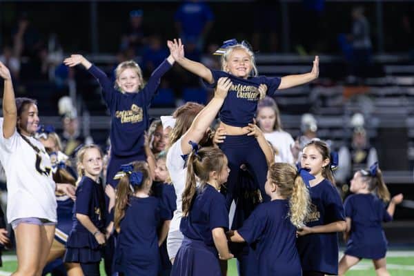 In Photos by Burrill Strong: Little Cheerleaders Take the Varsity Field ...
